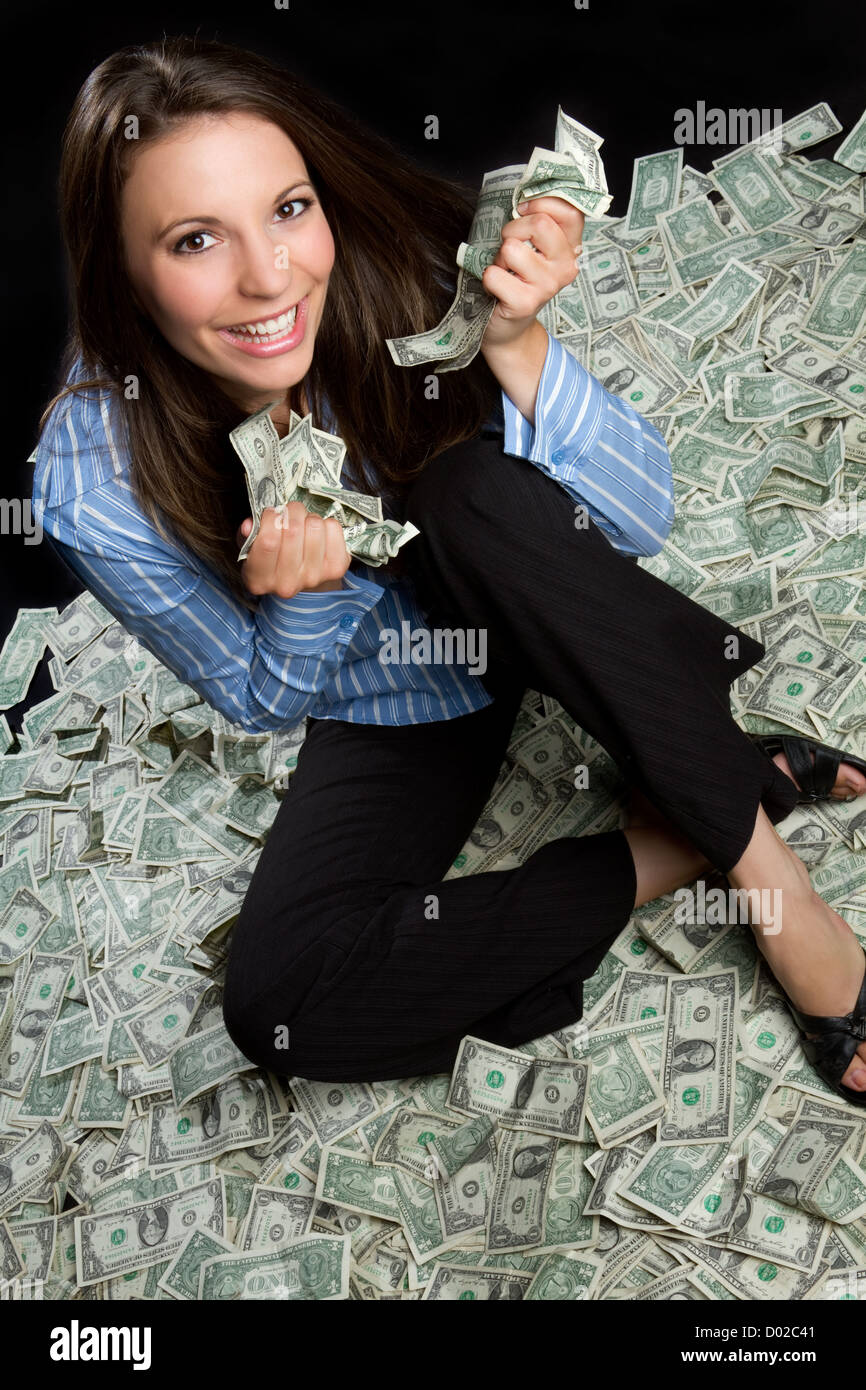 Woman sitting pile of money hi-res stock photography and images - Alamy