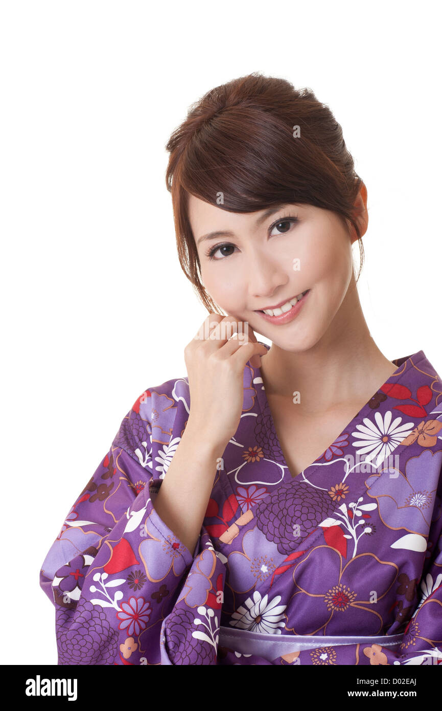 Attractive young Japaneses woman in traditional clothes looking at you ...