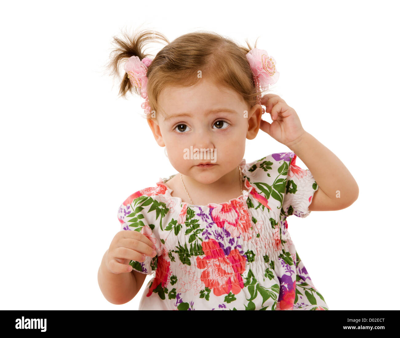 Serious little girl looking up isolated on white Stock Photo - Alamy