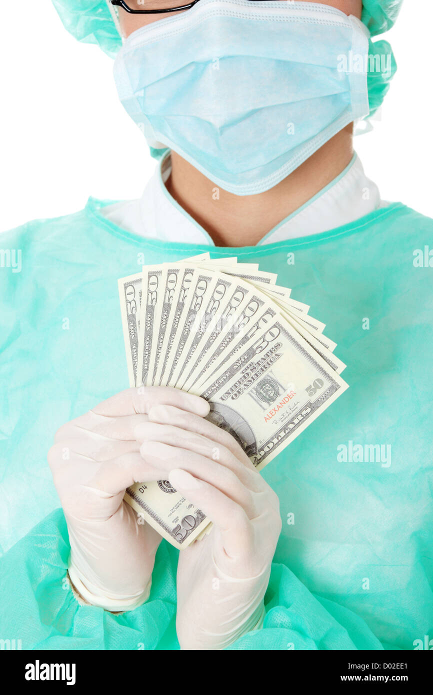 Female surgeon doctor holding money Stock Photo - Alamy
