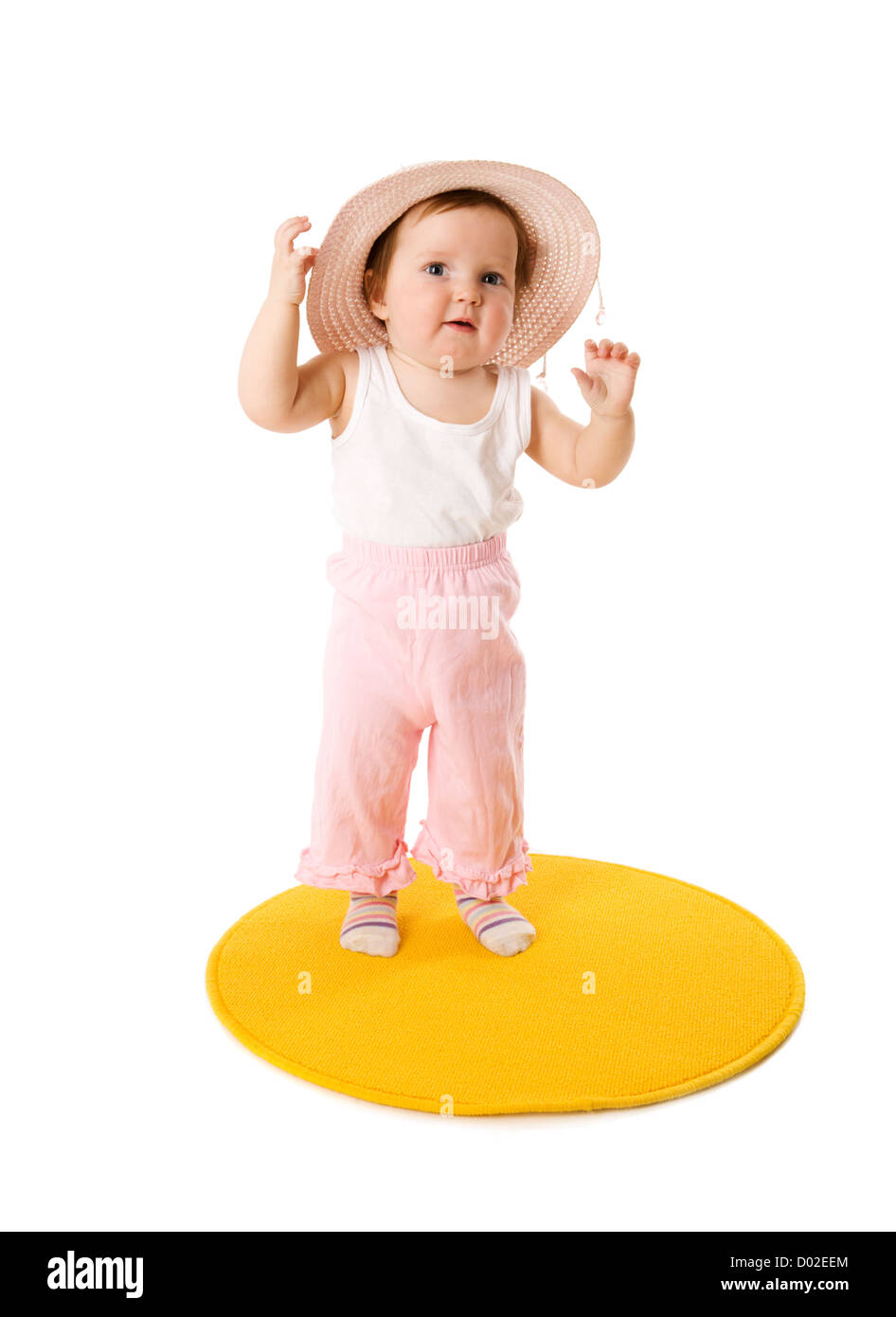 Baby girl wearing panama standing on carpet isolated Stock Photo - Alamy