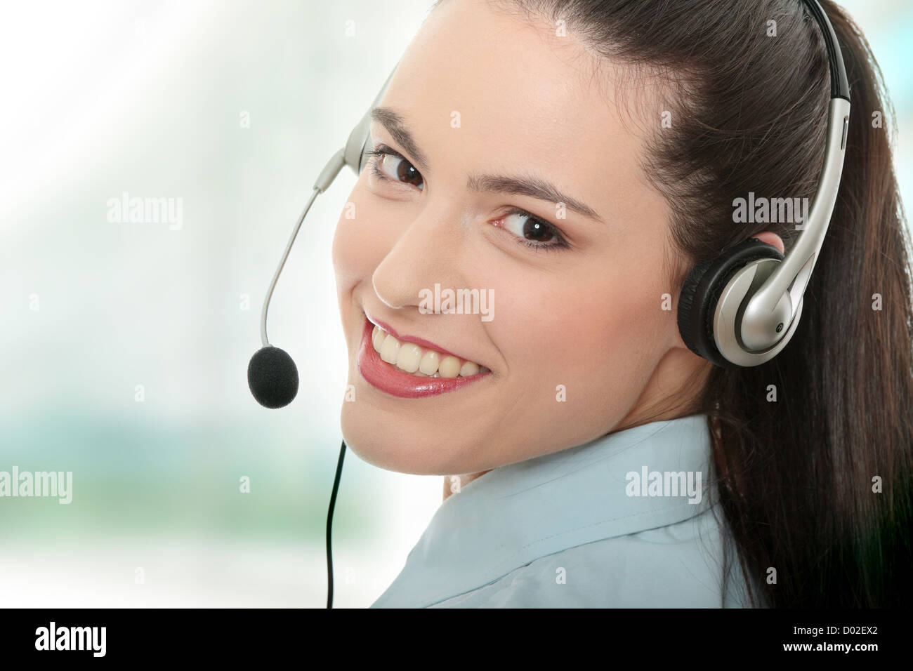 Call center woman with headset Stock Photo - Alamy