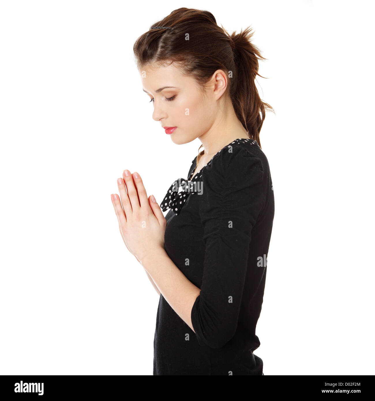 Closeup portrait of a young caucasian woman praying Stock Photo - Alamy