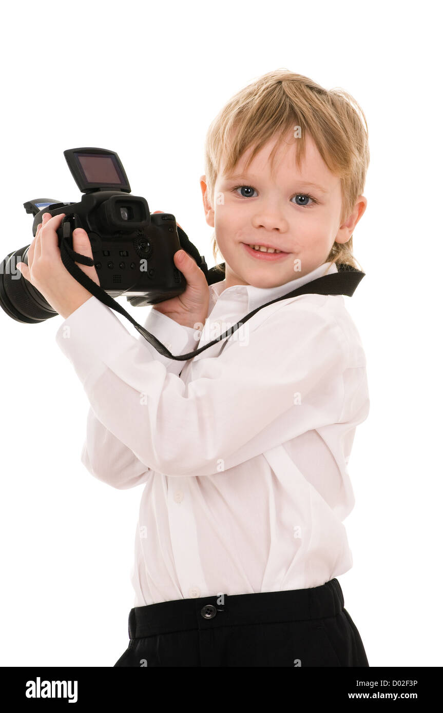 The child in a white shirt with the camera isolated on white background ...