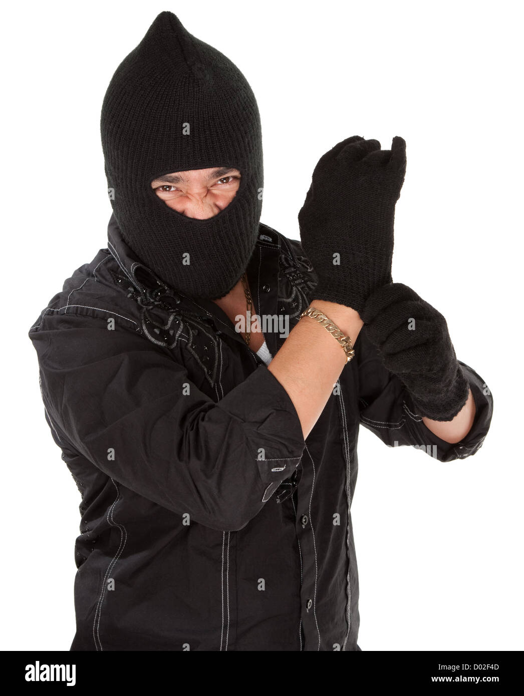 Angry burglar wearing a black woollen mask Stock Photo - Alamy
