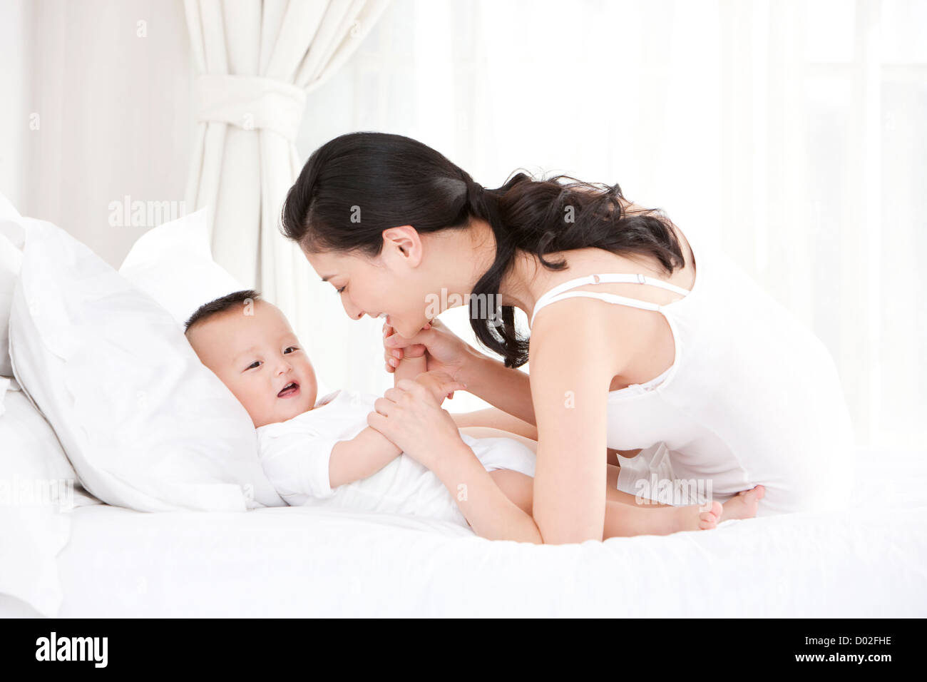 Happy moment between mother and baby Stock Photo - Alamy