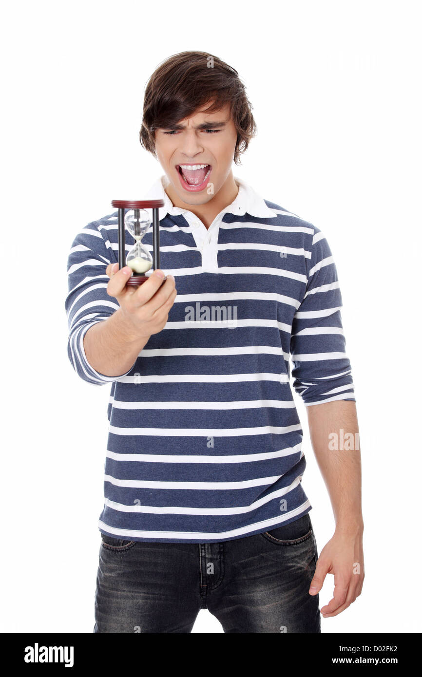 Young man with hourglass Stock Photo - Alamy
