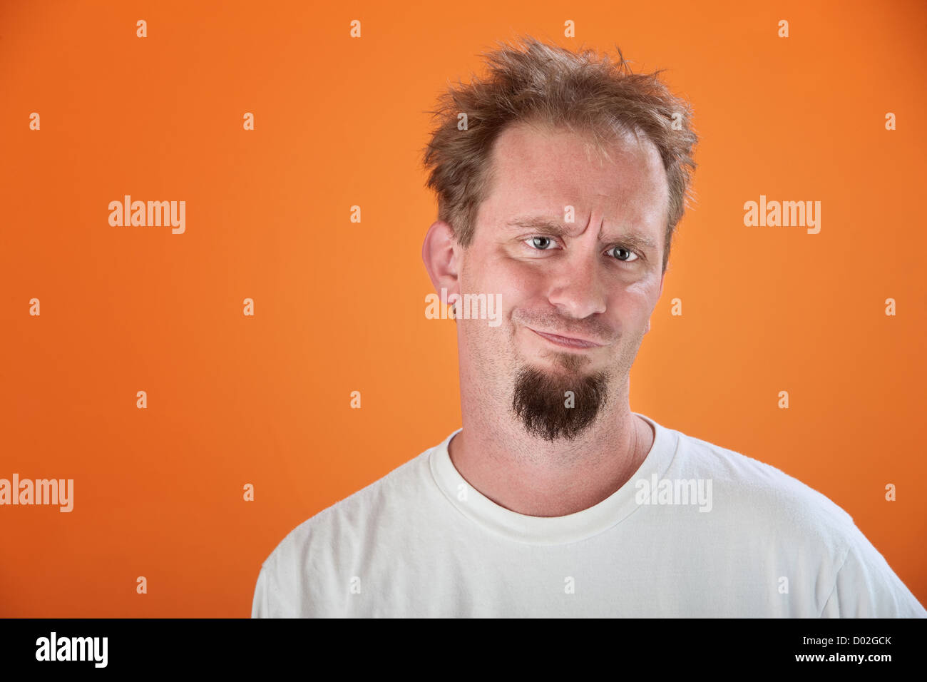Caucasian man with a goatee is unimpressed Stock Photo - Alamy