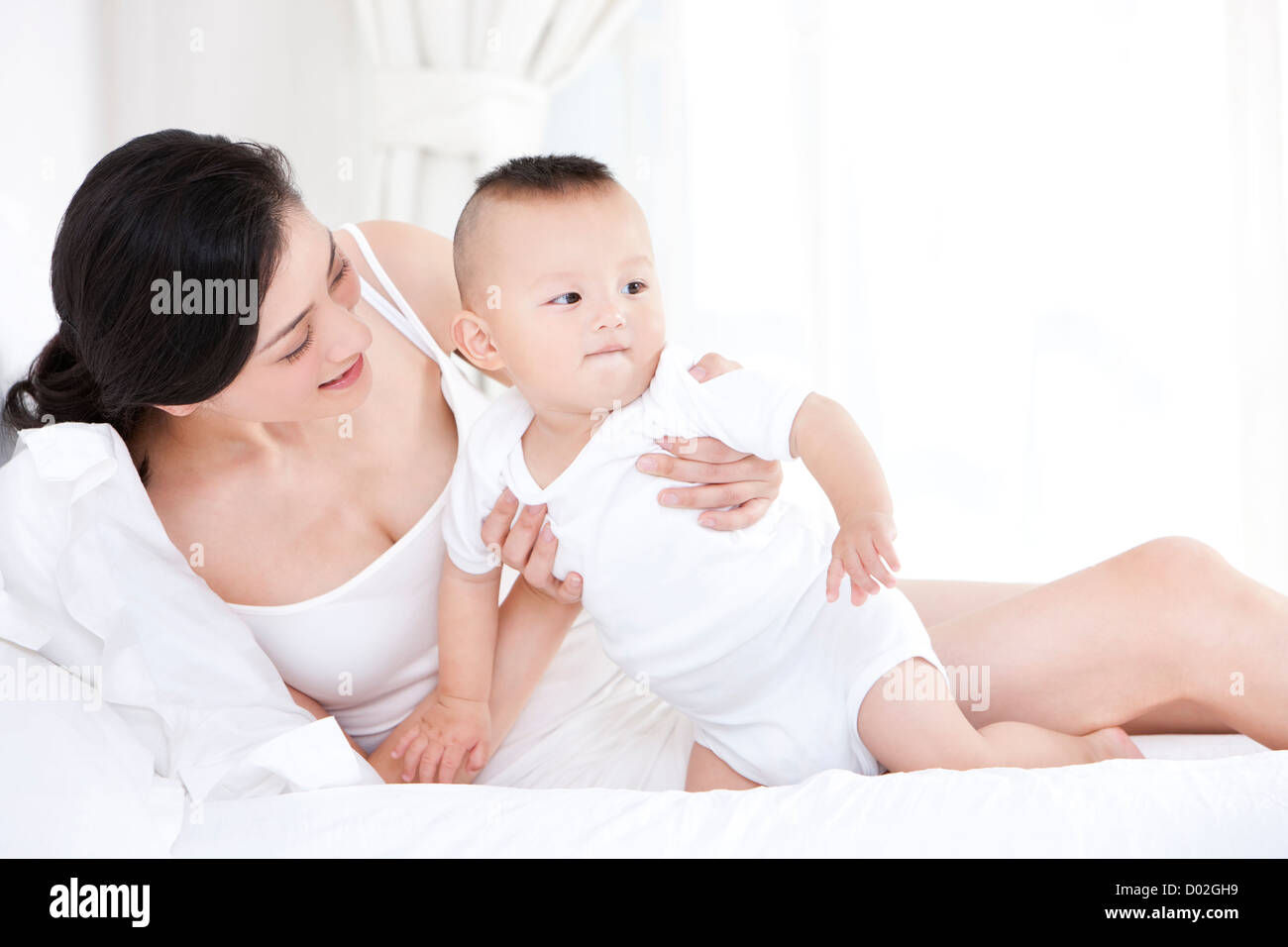 Mother and baby having a sweet time Stock Photo - Alamy