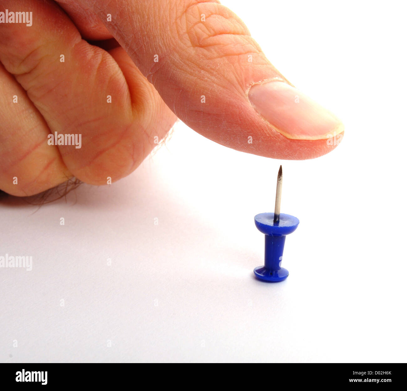 risk concept with finger over risky pin Stock Photo - Alamy