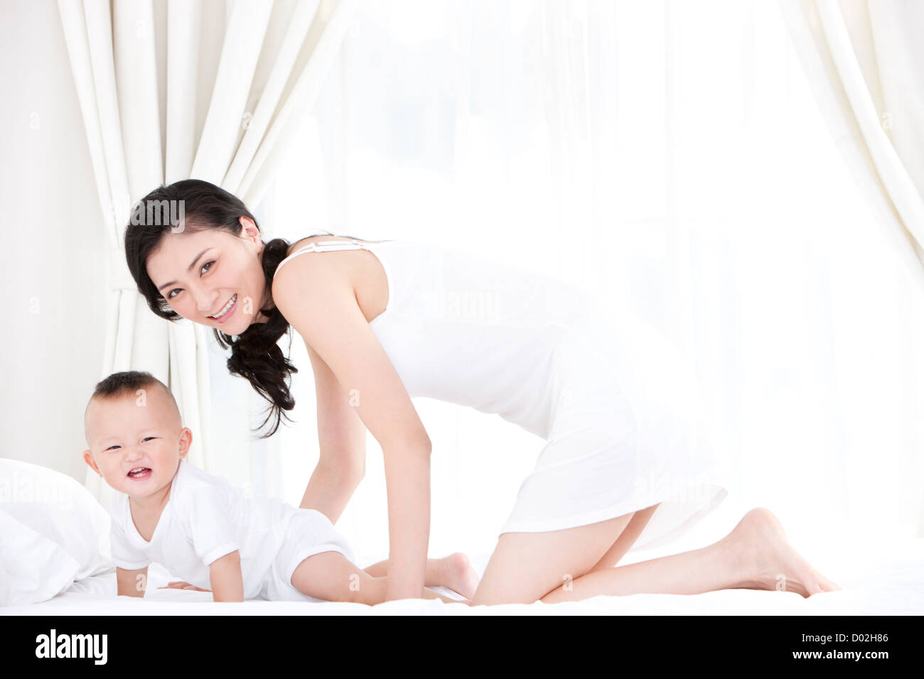Mother and baby having a good time Stock Photo - Alamy