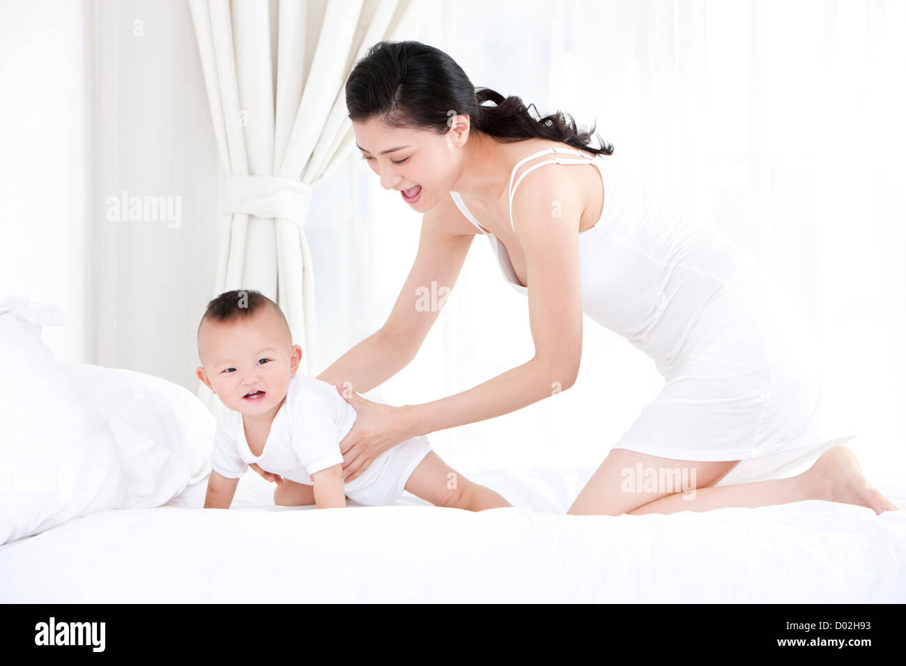 Mother and baby having a good time Stock Photo - Alamy