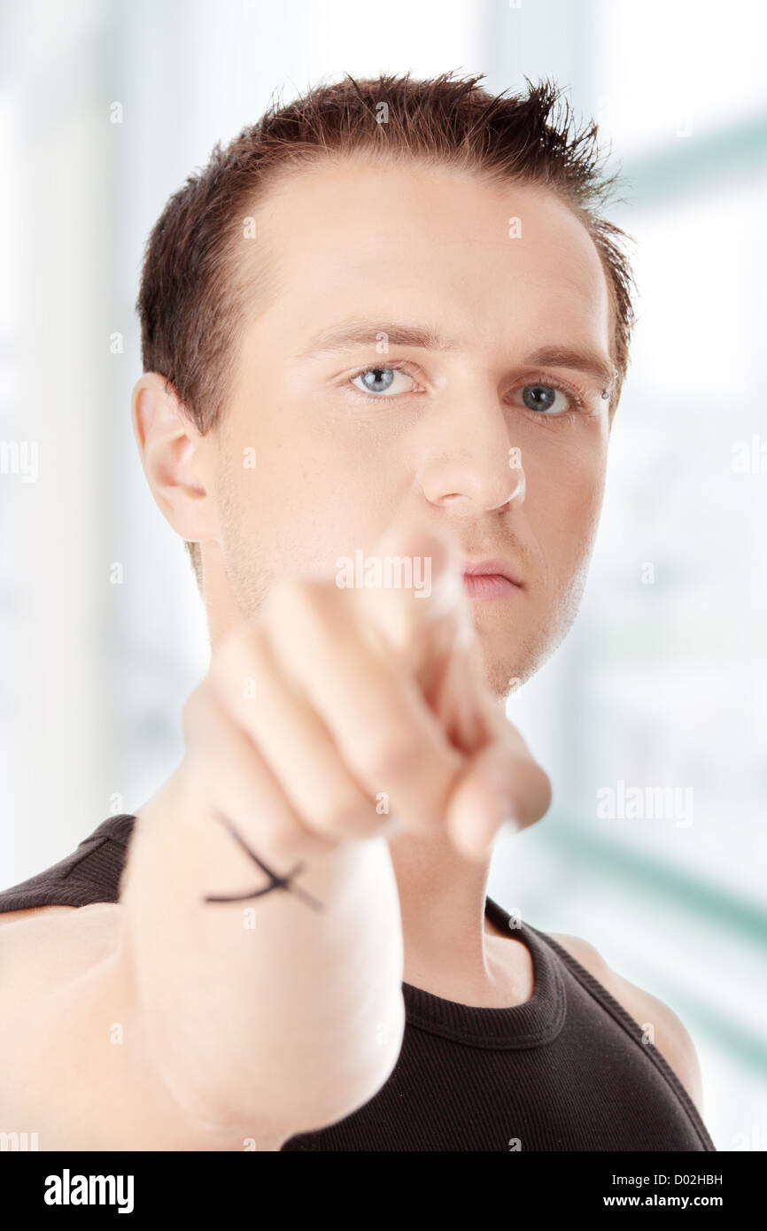 Young caucasian man, pointing at camera. Isolated on white Stock Photo ...