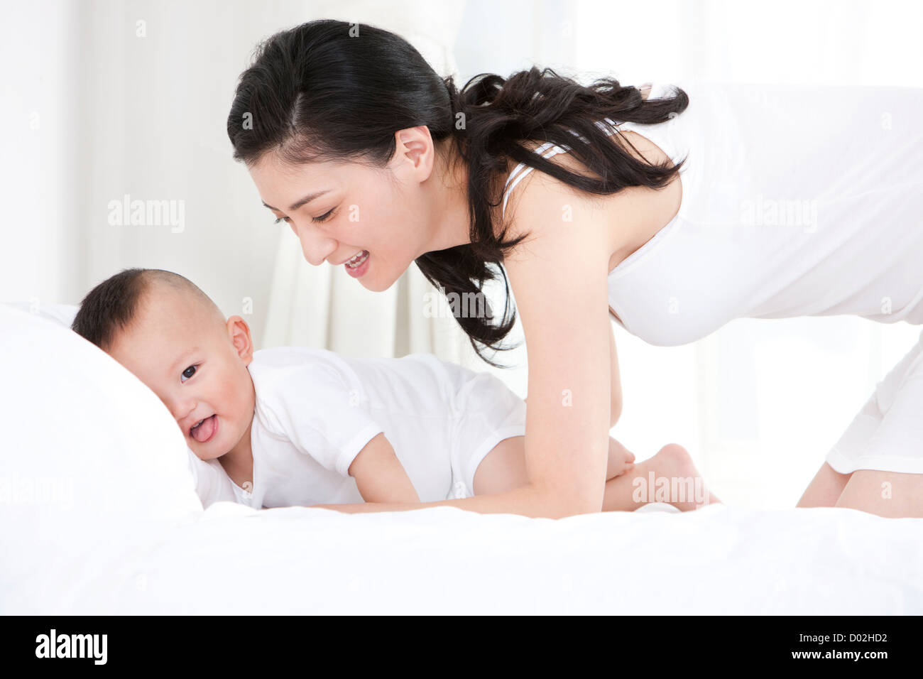 Tender moment between mother and baby Stock Photo - Alamy