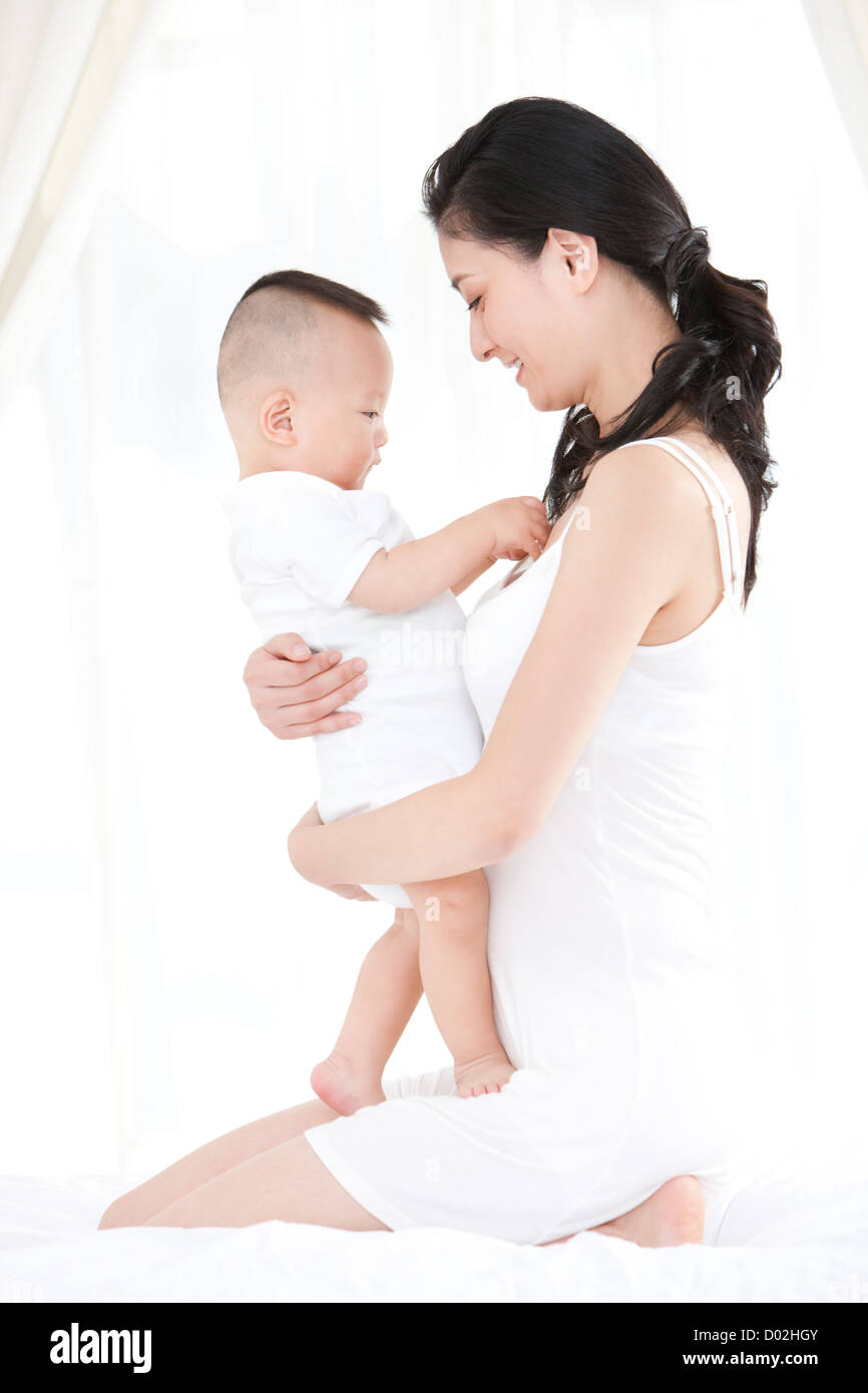 Tender moment between mother and baby Stock Photo - Alamy