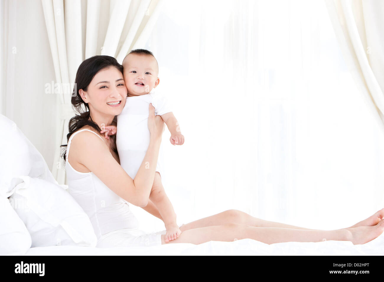 Mother loving cute little baby Stock Photo - Alamy