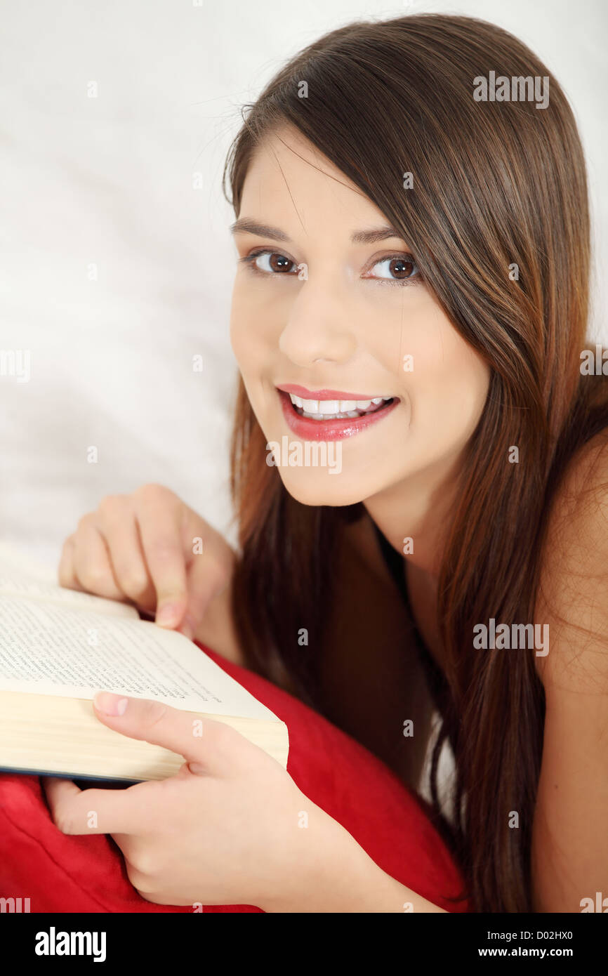 Beautiful woman reading a book Stock Photo - Alamy