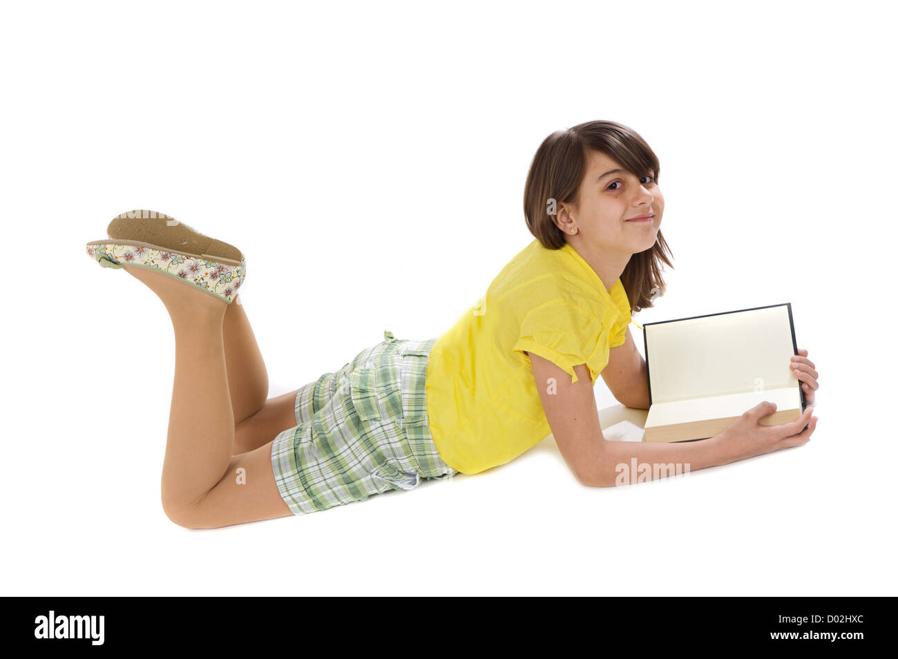 Pretty girl reading on a over white background Stock Photo - Alamy