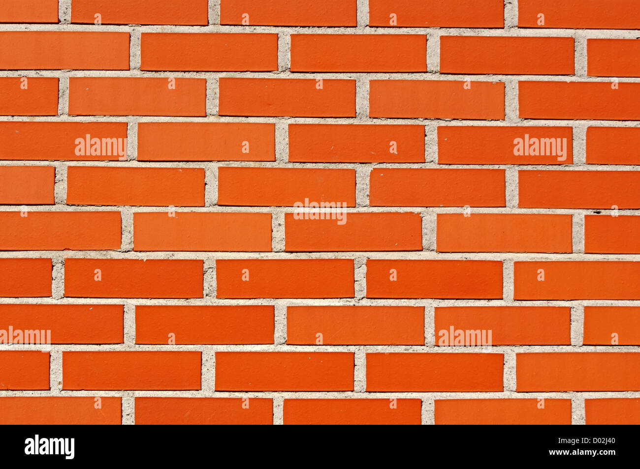 photo of a plain red Brick wall for background Stock Photo - Alamy