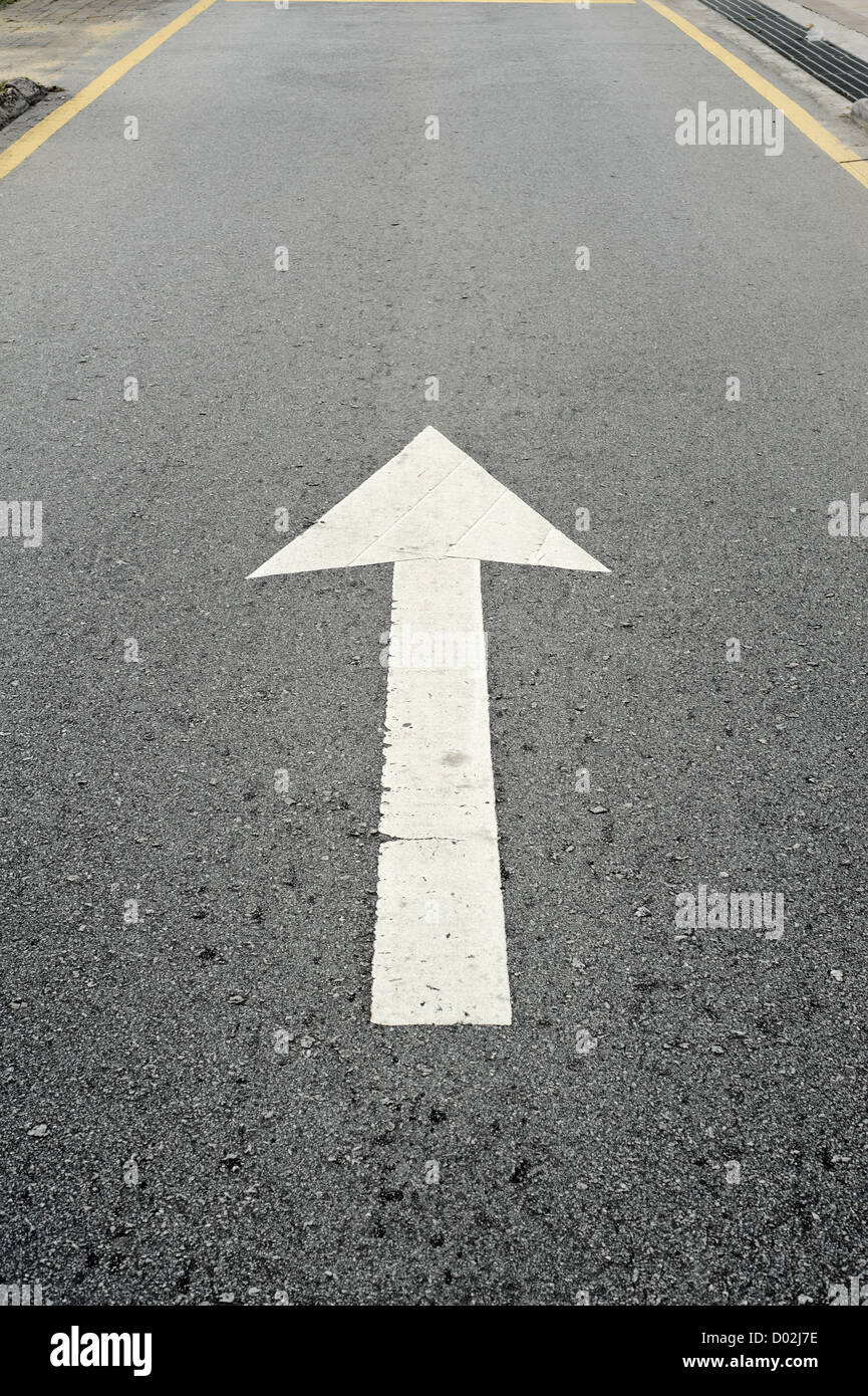 Tansportation sign of driving forward or up direction mark on the road ...