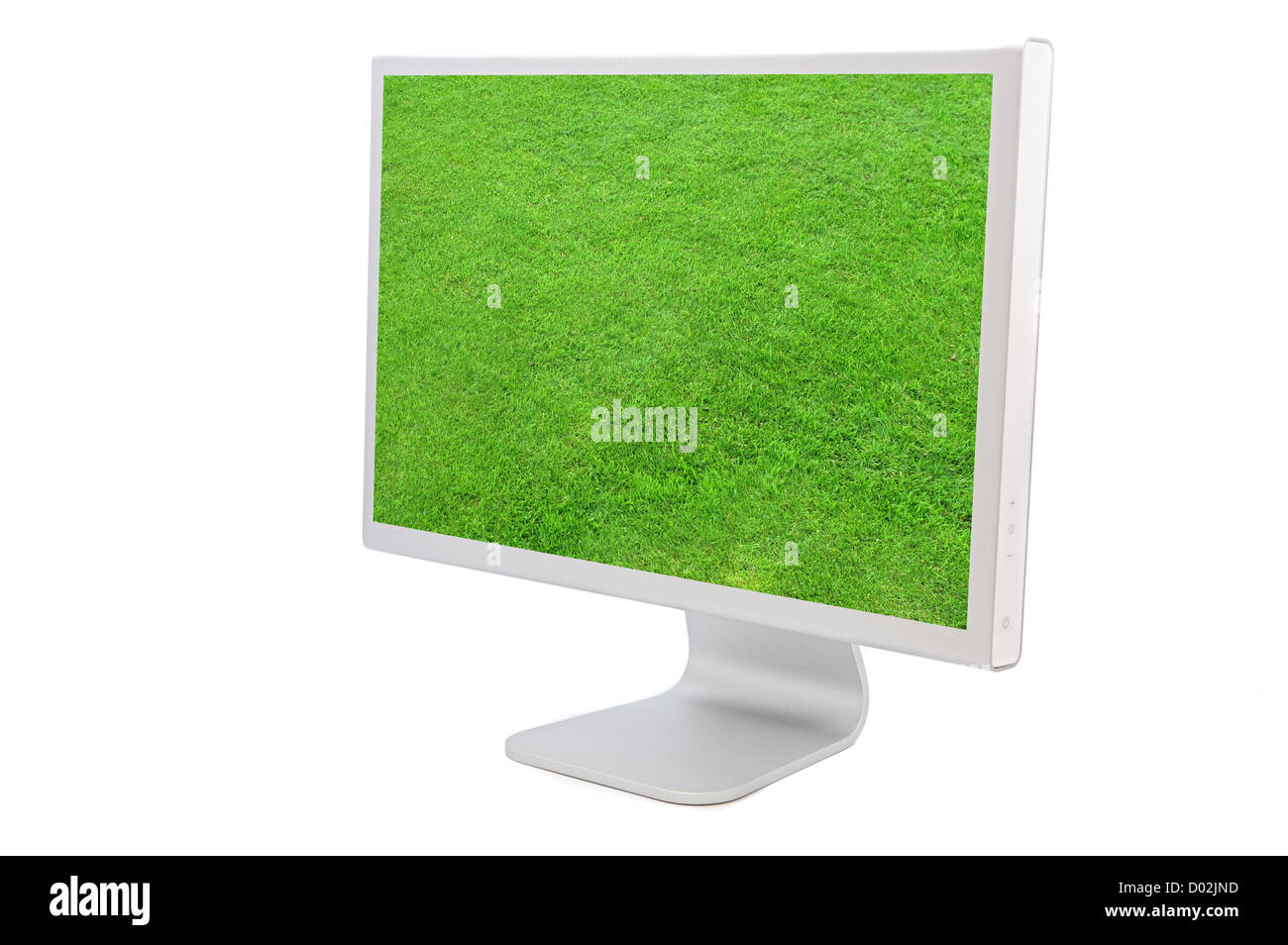Computer monitor with the image of a green grass solated on white ...