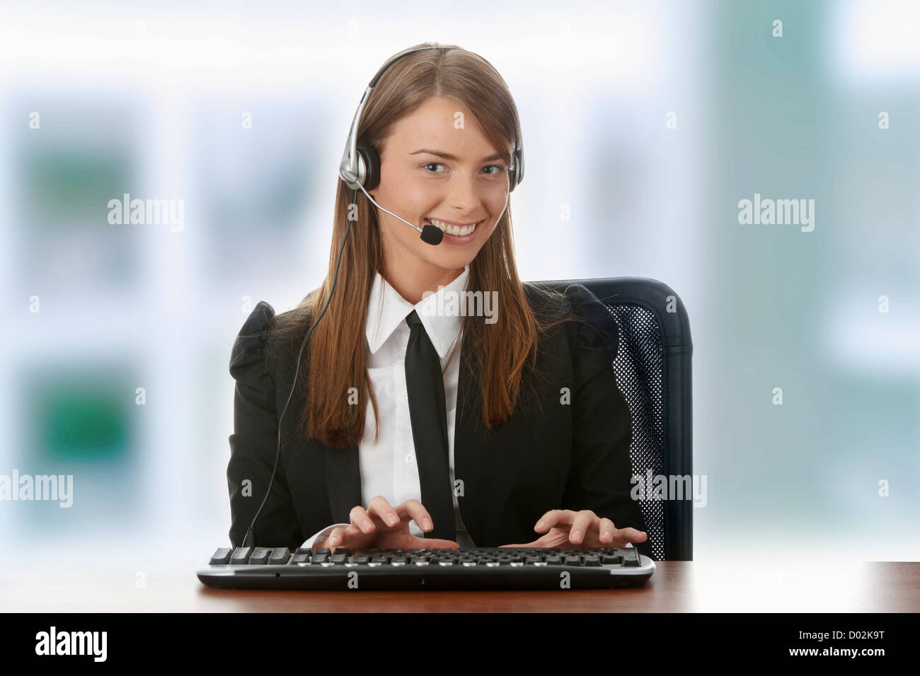 Young beautiful customer service operator girl in headset ,sitting at ...