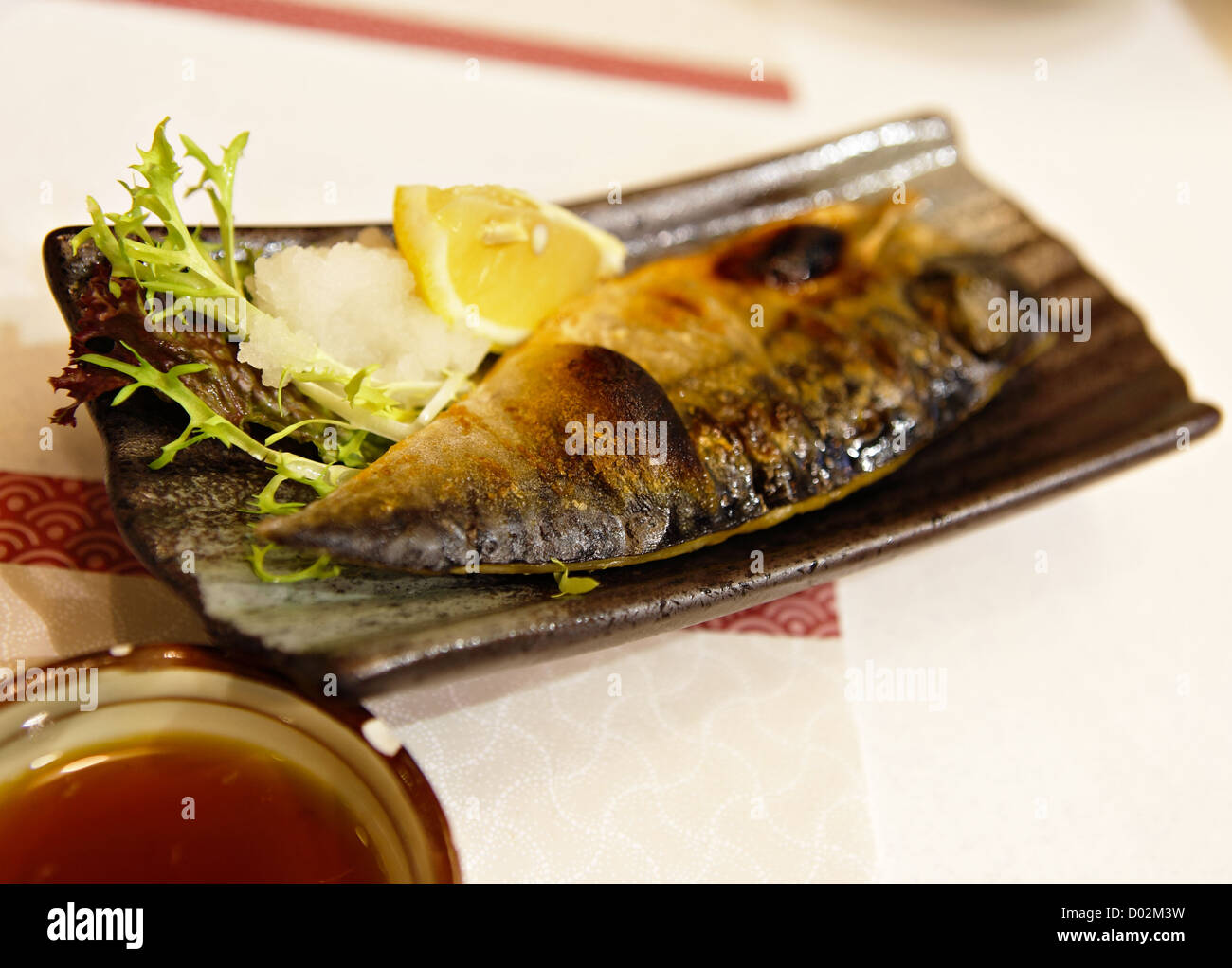 Fish cooking in grill fat hi-res stock photography and images - Alamy