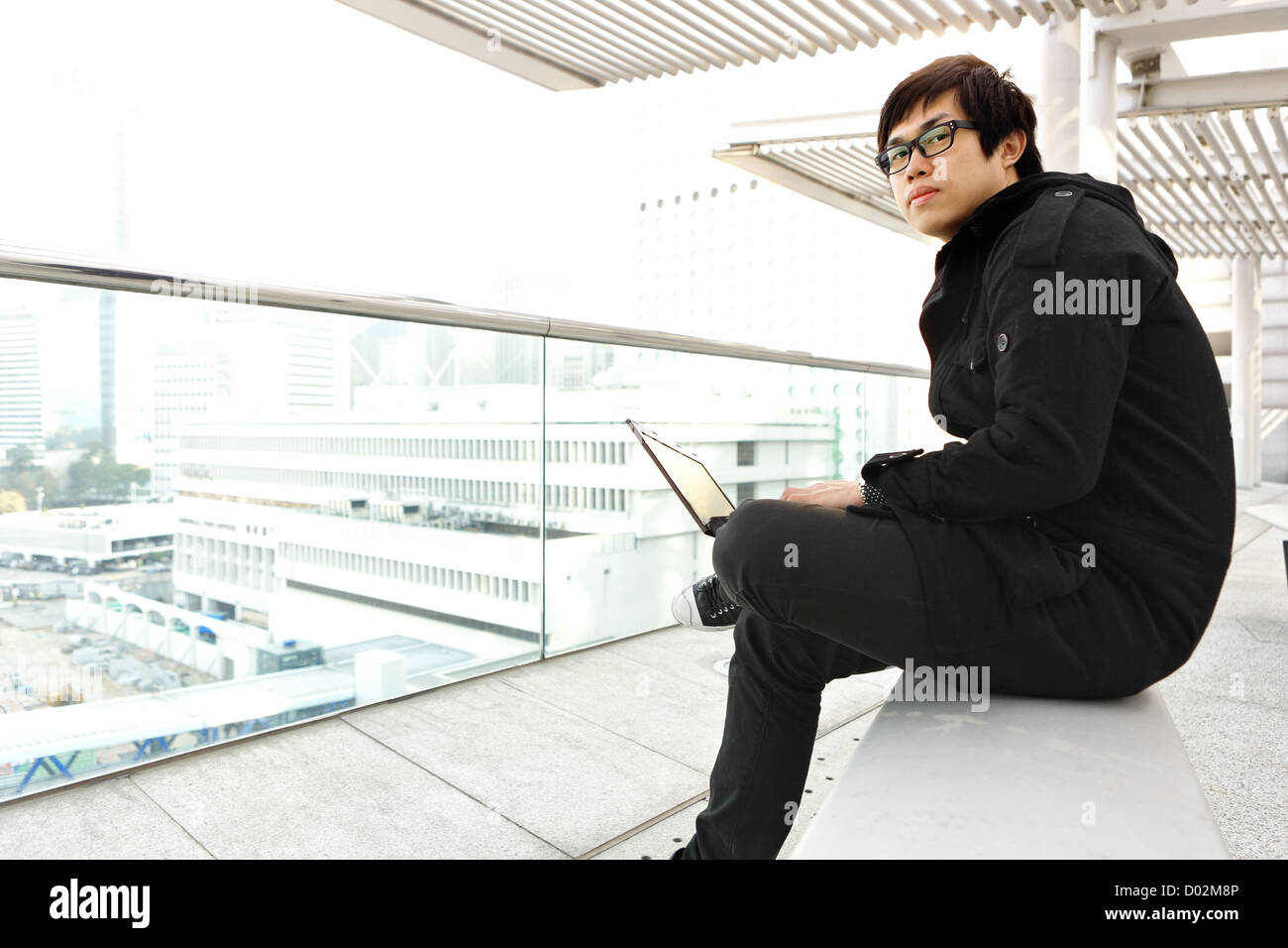 man using computer outdoor Stock Photo - Alamy