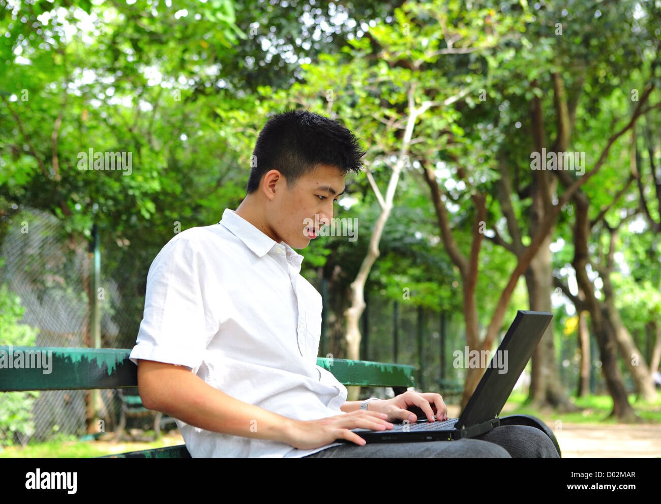 man using computer outdoor Stock Photo - Alamy