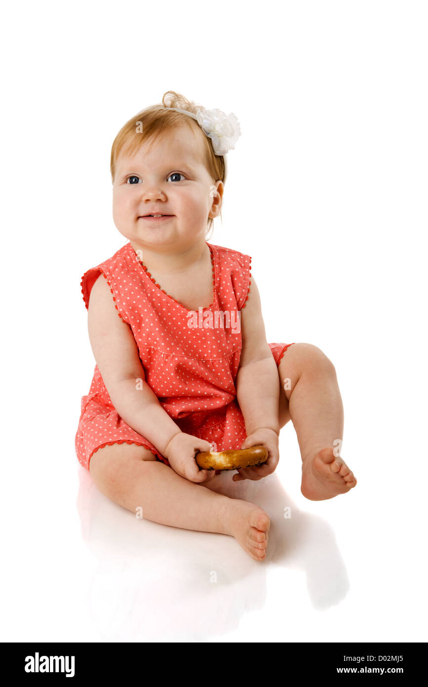 Little girl eating white bread Cut Out Stock Images & Pictures - Alamy