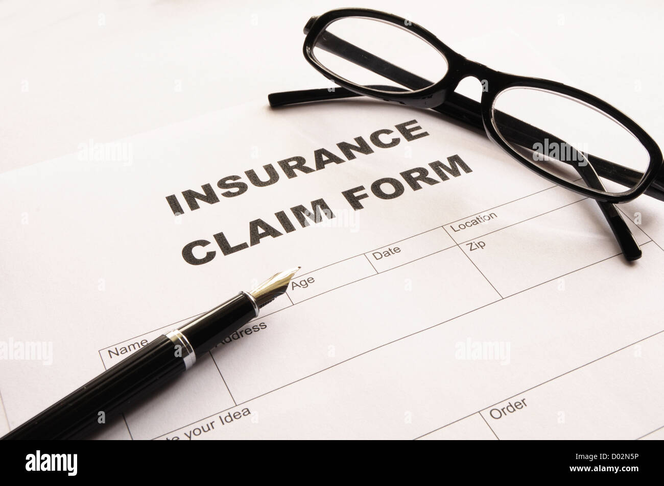 insurance claim for on desk in office showing risk concept Stock Photo ...