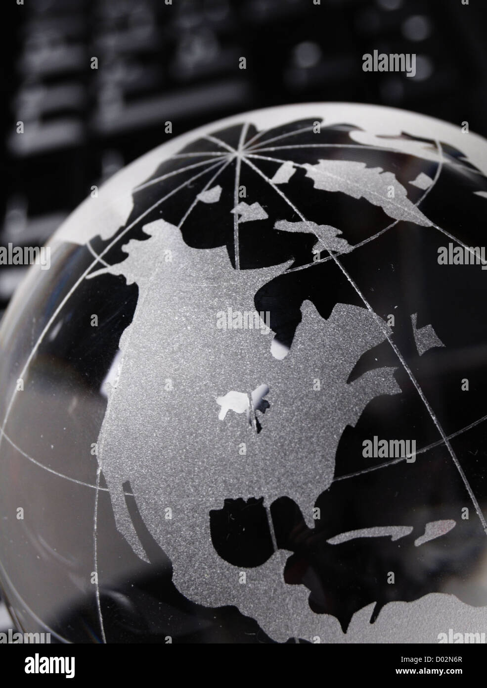 globe and keyboard showing global communication or internet concept ...