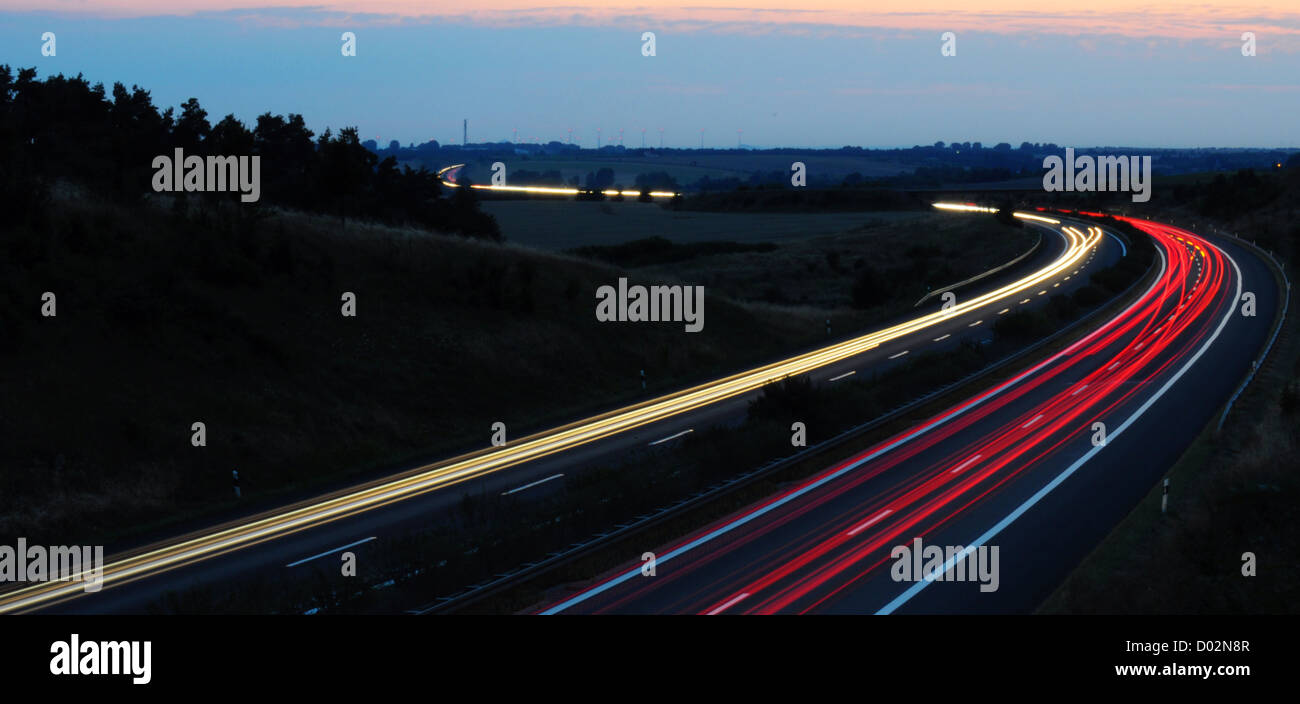 night time traffic on highway with lights showing transportation ...