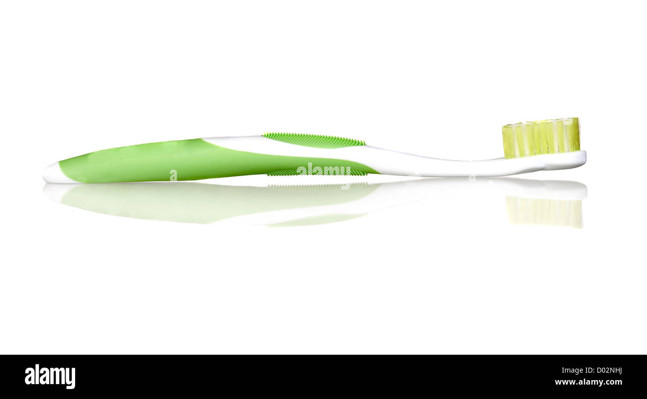Green toothbrush isolated on white background with reflection on the ...