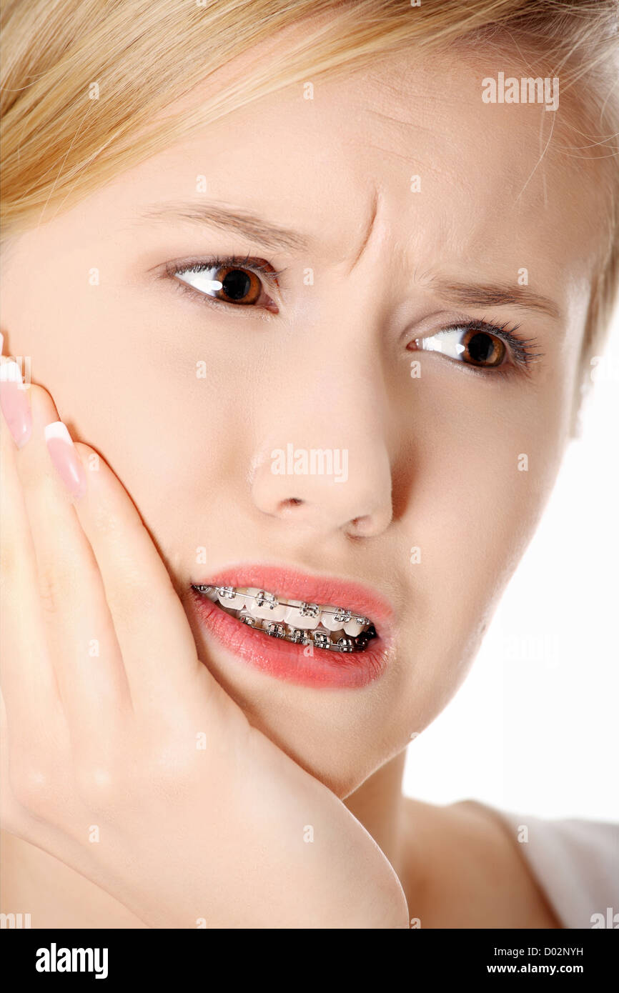 Beautiful young woman is having toothache isolated on white Stock Photo ...