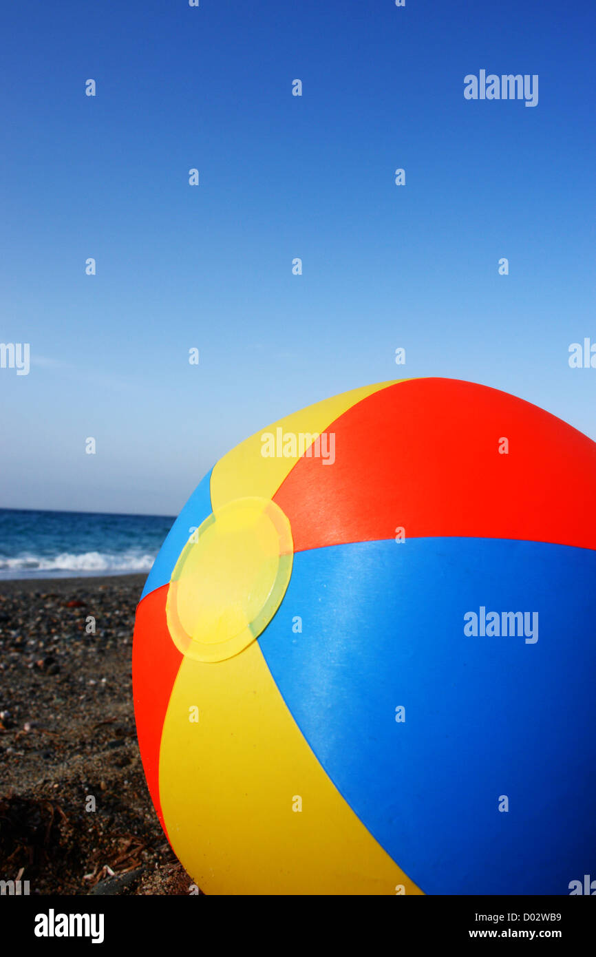 bright multicolored beach ball on the beach Stock Photo - Alamy