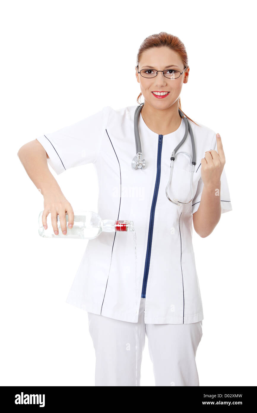 Female doctor pouring vodka bottle Stock Photo - Alamy
