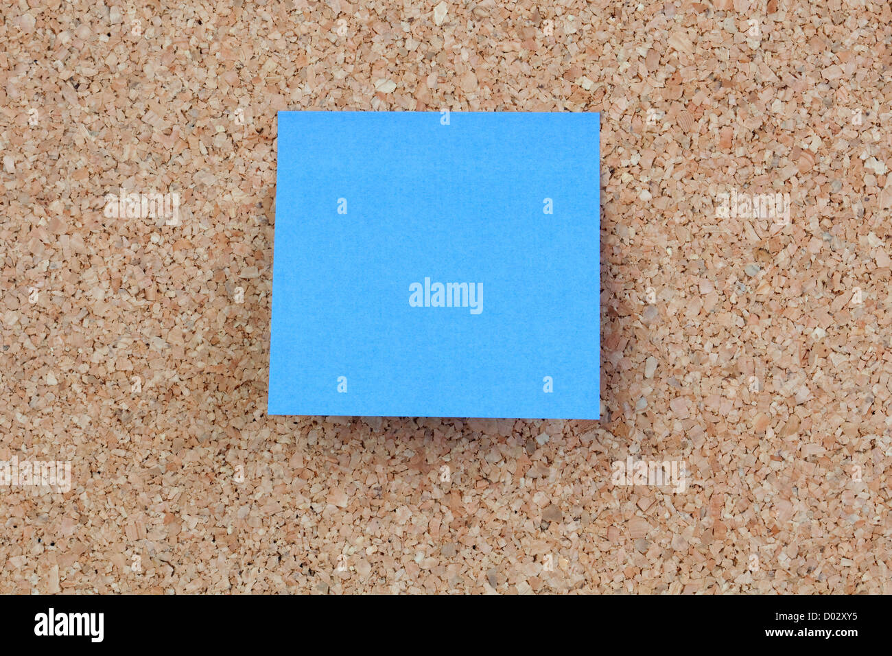 Photo of corkboard with a blue post-it Stock Photo - Alamy