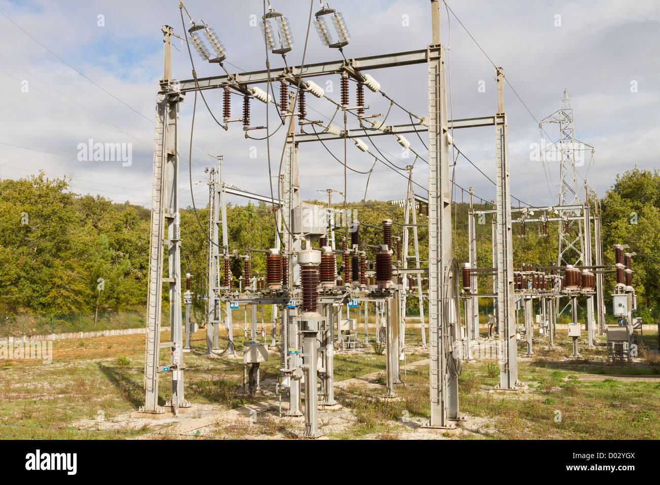 Part of High Voltage Station connectors against sky and woods Stock ...