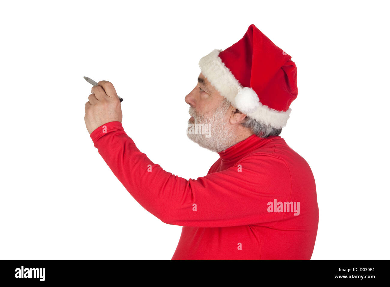 Funny Santa Claus writing with a pen isolated on white background Stock ...