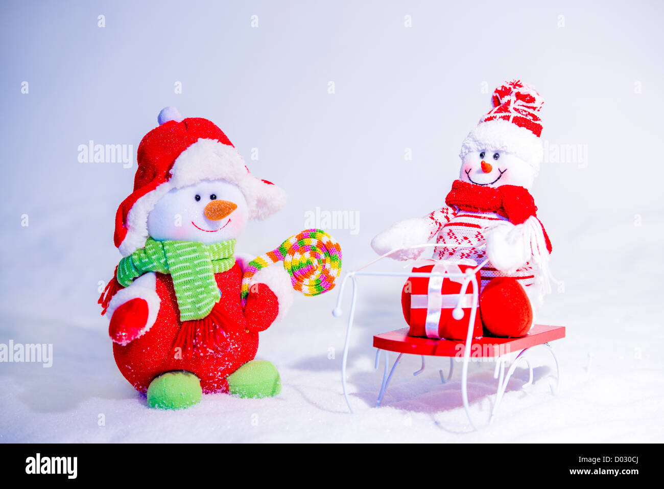 Two happy snowmen smiling at each other Stock Photo - Alamy