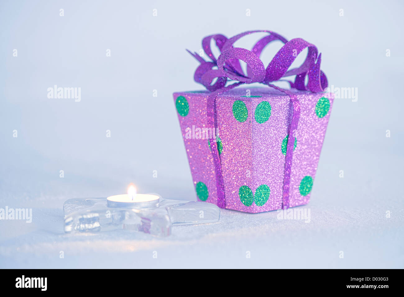 Glitter gift box. Purple gift box with big bow and green spots. Copy ...