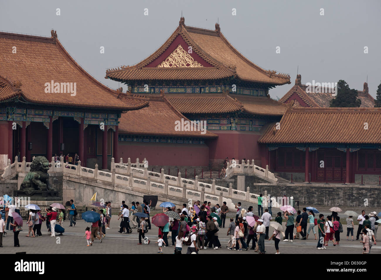 People walking around one of the squares in the Forbidden City, Beijing ...