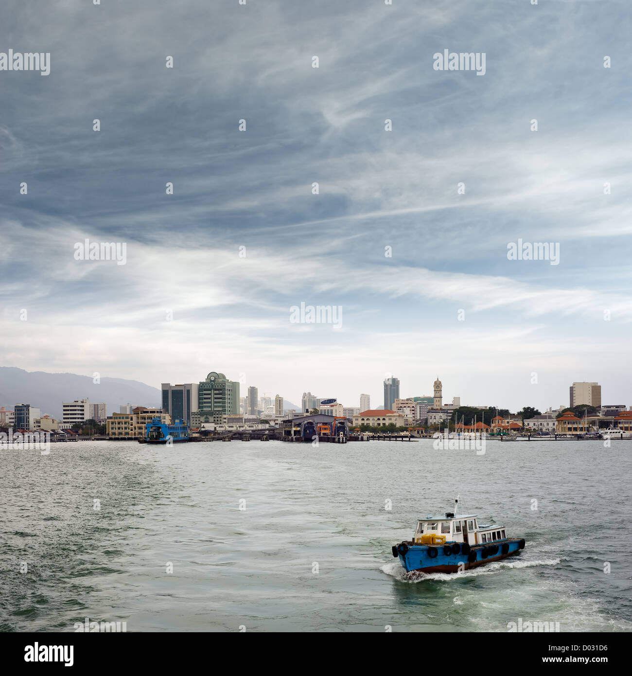 Penang cityscape with boats on ocean and skyscraper in Malaysia, Asia ...