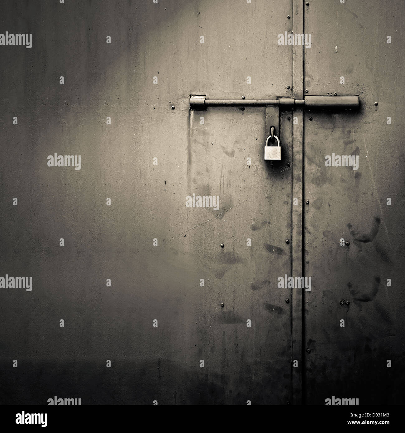 Background of door with lock in metal material and copyspace on wall ...