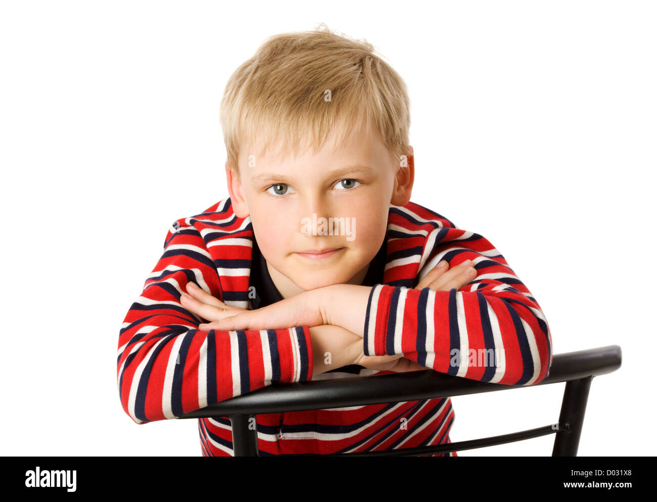 Happy seven years boy staring at you isolated Stock Photo - Alamy
