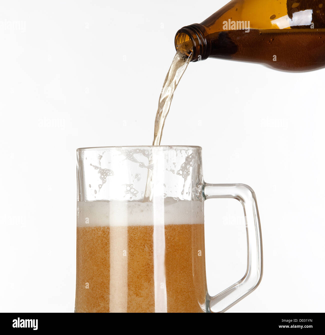 Putting beer in a glass jar on white background isolated Stock Photo ...