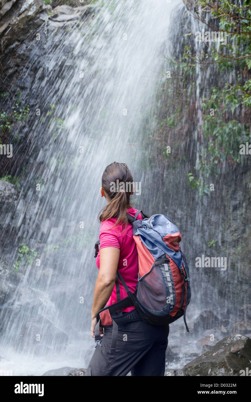 Female hiker near mountain waterfall on Gran Canaria, Canary Islands ...
