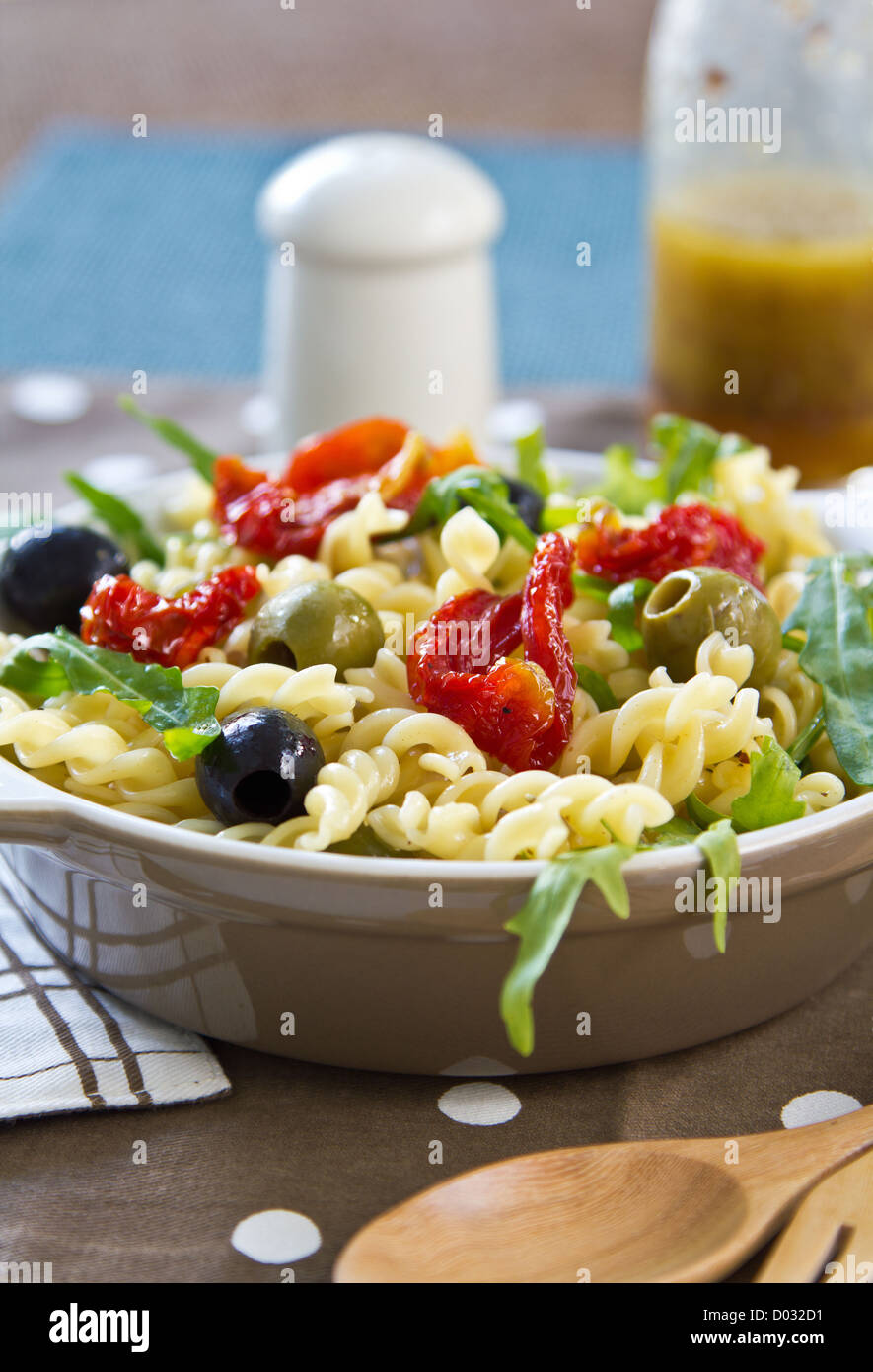 Fusilli with Sun dried tomato and Rocket salad Stock Photo - Alamy
