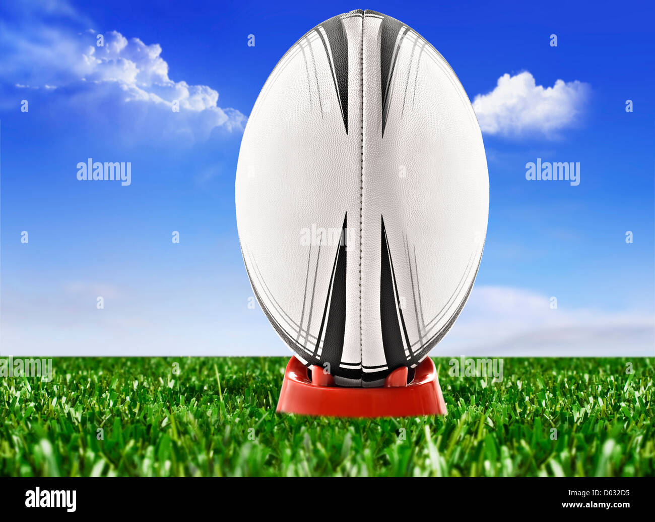 Rugby ball on the field with sky and clouds Stock Photo - Alamy